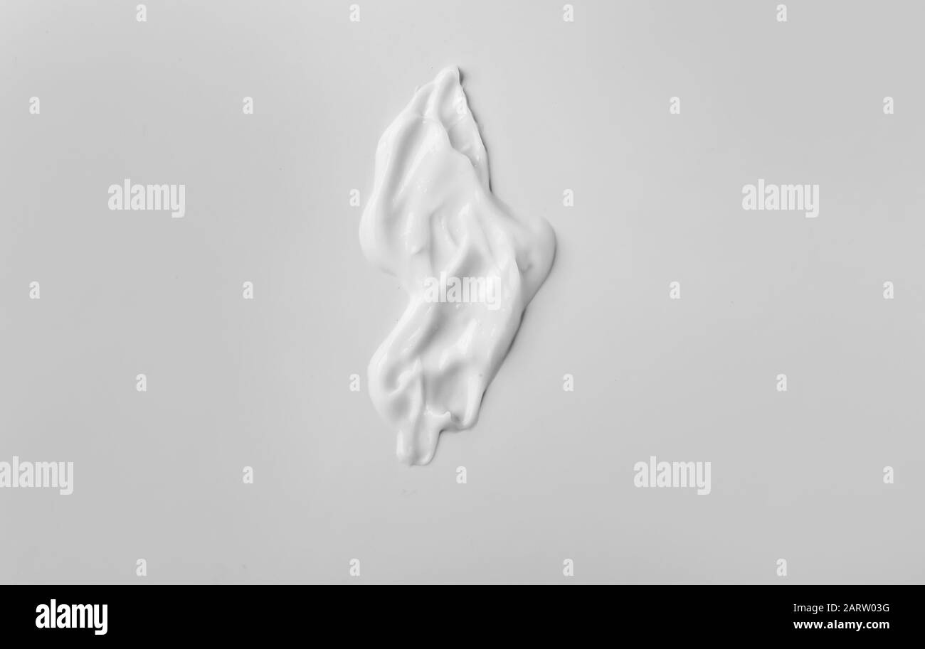 Sample of cream on white background Stock Photo - Alamy
