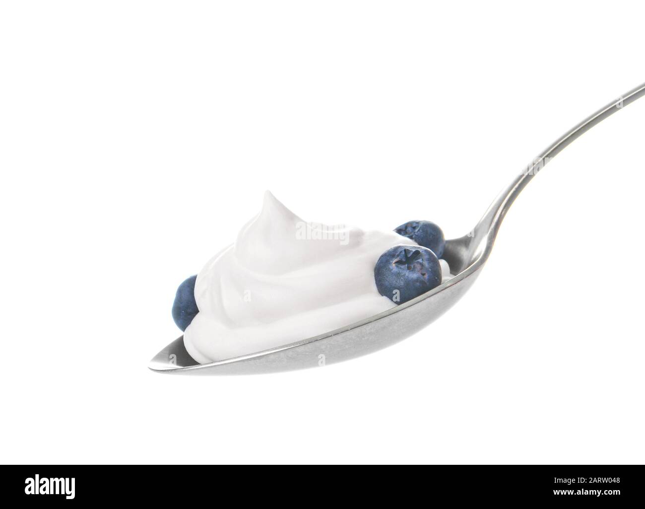 Spoon with whipped cream and berries on white background Stock Photo ...