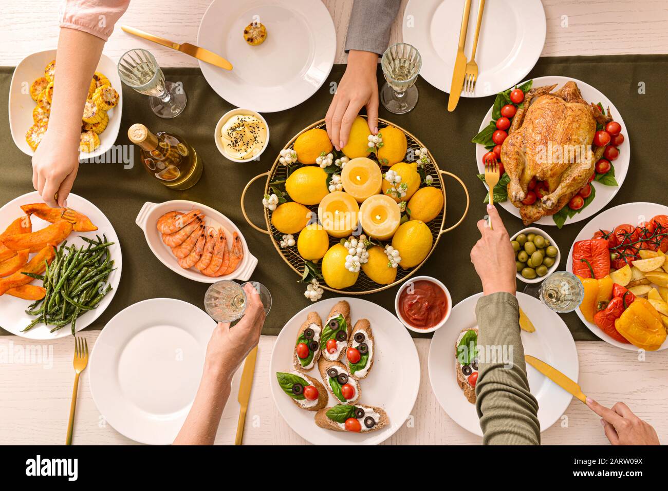 Friends having dinner at table, top view Stock Photo - Alamy