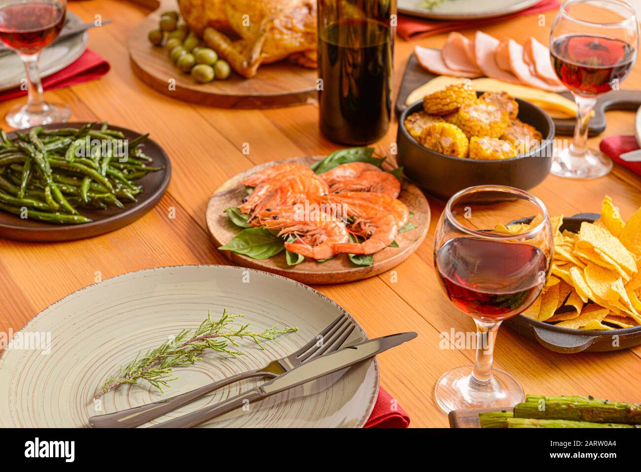 Table set for big family dinner Stock Photo - Alamy