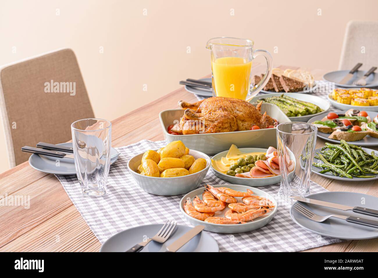 Table set for big family dinner Stock Photo - Alamy