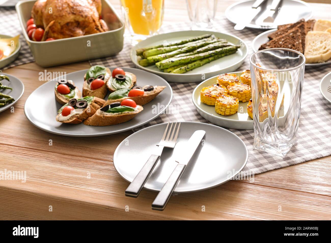 Table set for big family dinner Stock Photo - Alamy