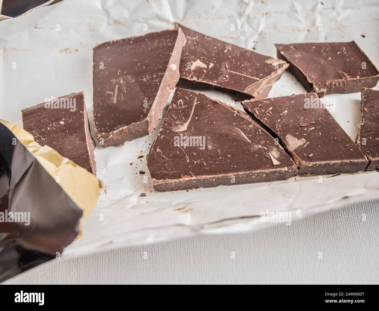 Broken brown chocolate Stock Photo - Alamy