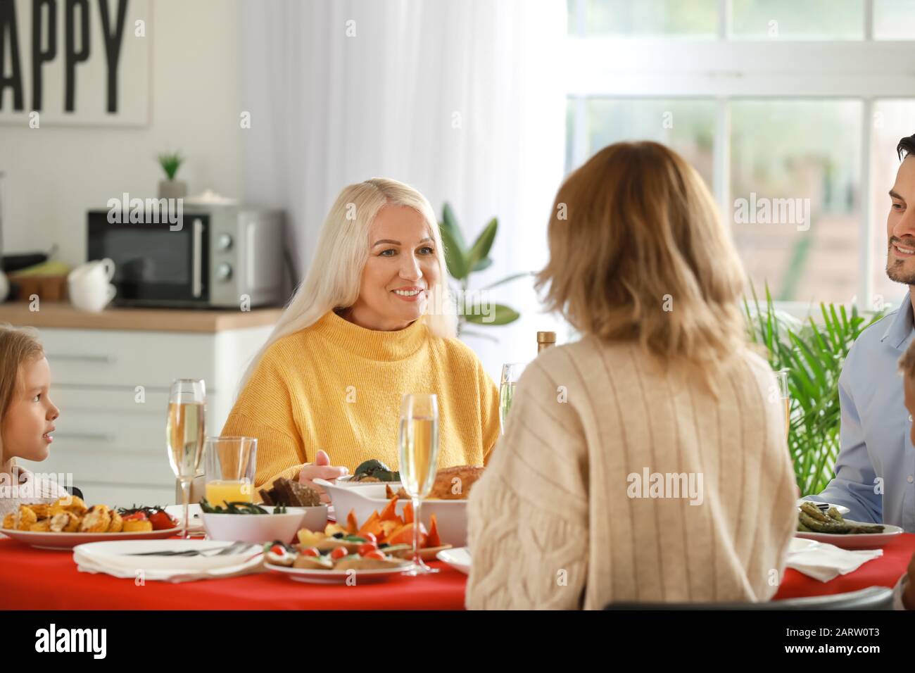 Big family having dinner at home Stock Photo - Alamy