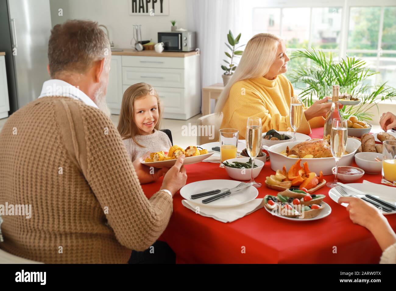 Big family having dinner at home Stock Photo - Alamy
