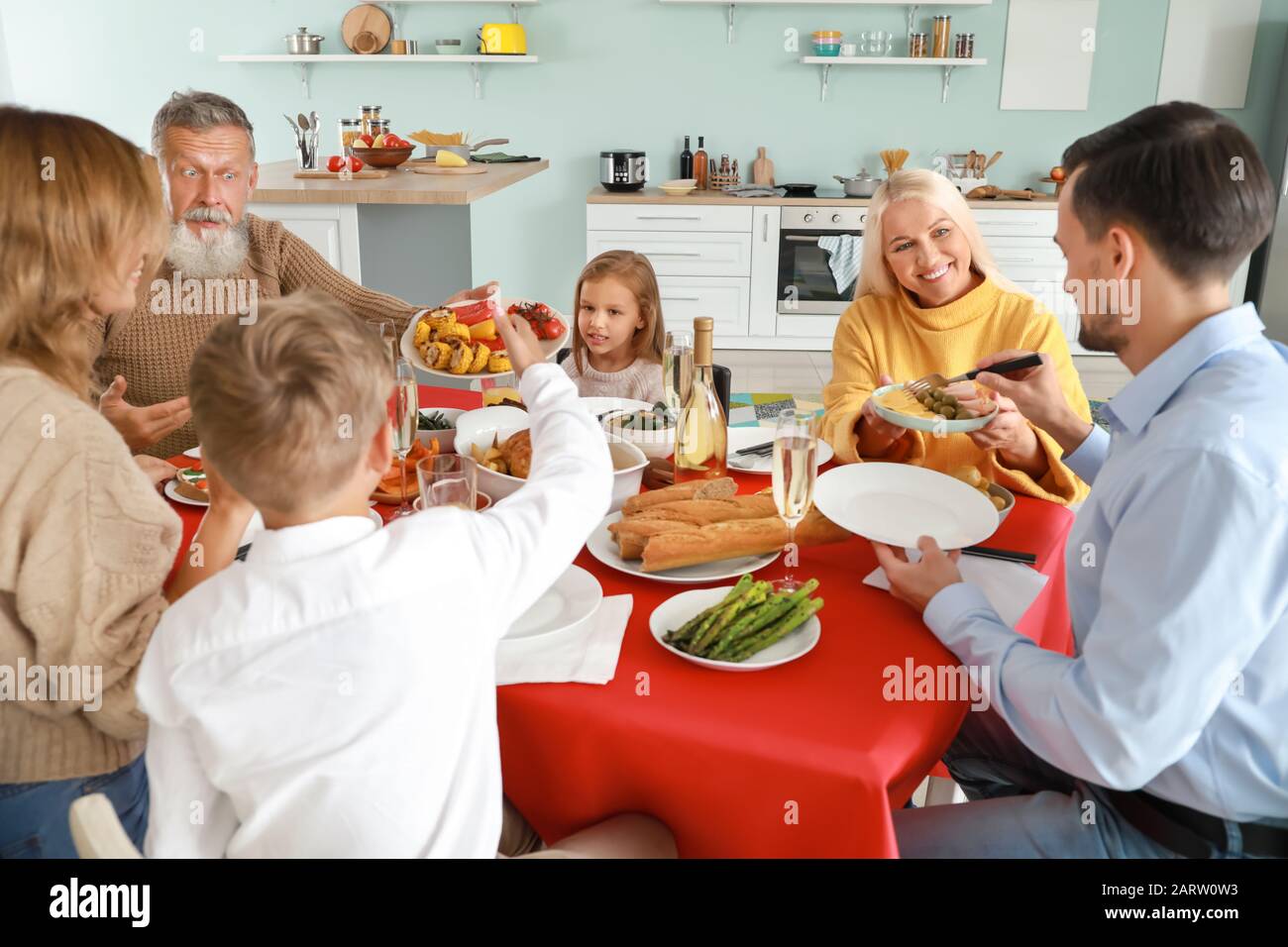 Big family having dinner at home Stock Photo - Alamy