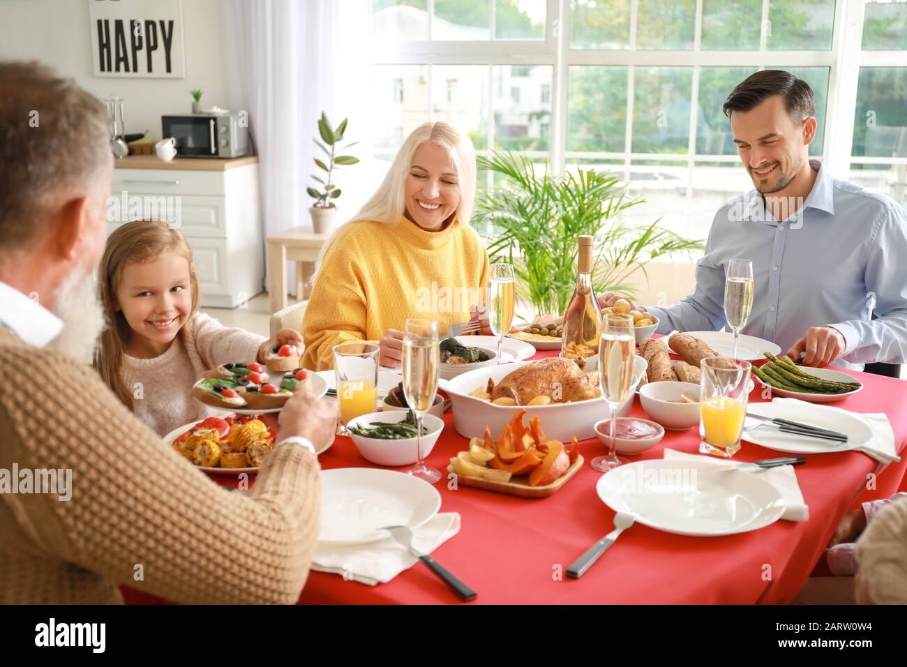 Big family having dinner at home Stock Photo - Alamy