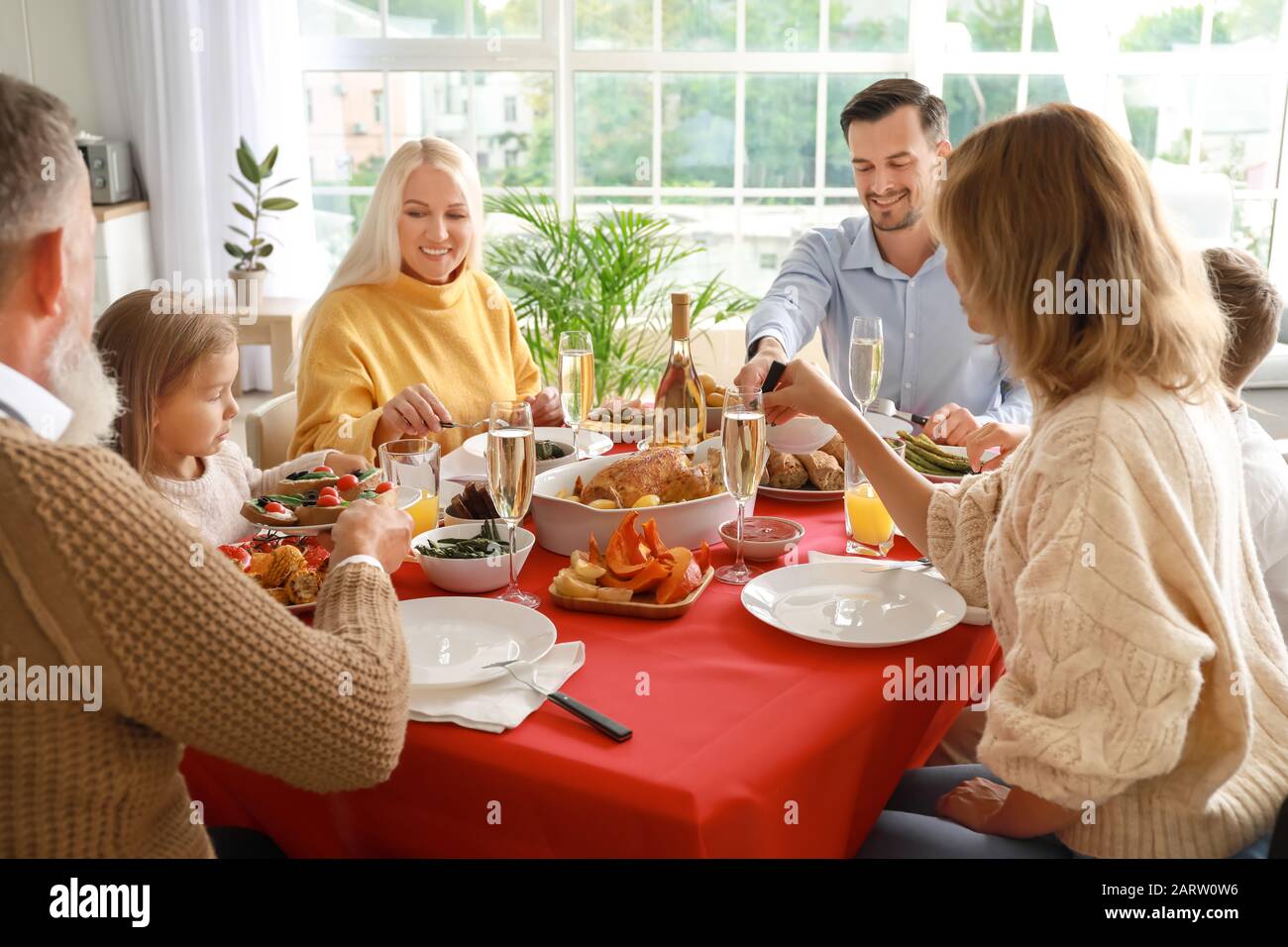 Big family having dinner at home Stock Photo - Alamy