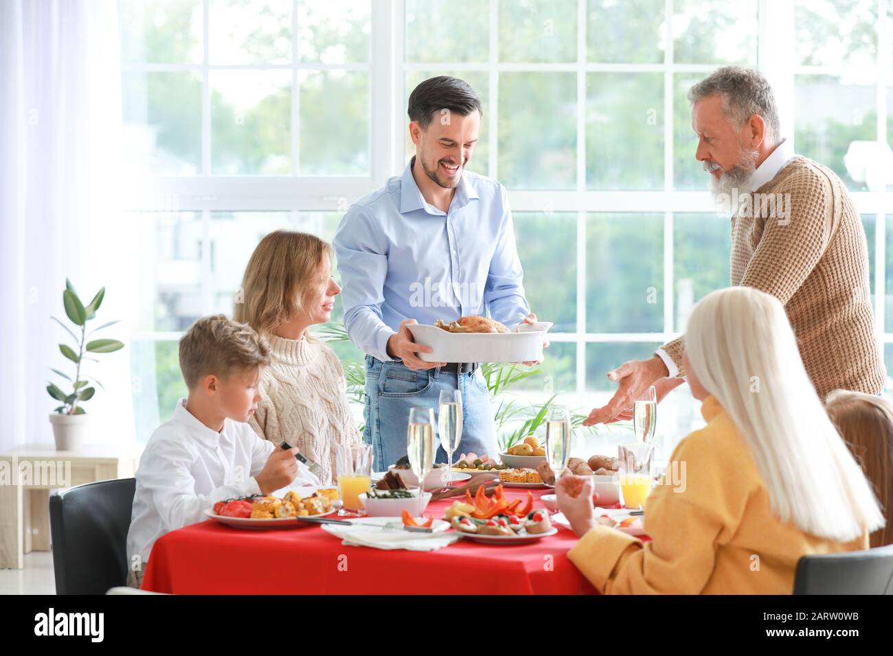 Big family having dinner at home Stock Photo - Alamy