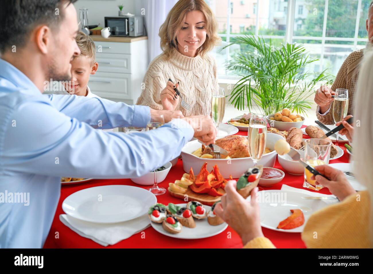 Big family having dinner at home Stock Photo - Alamy