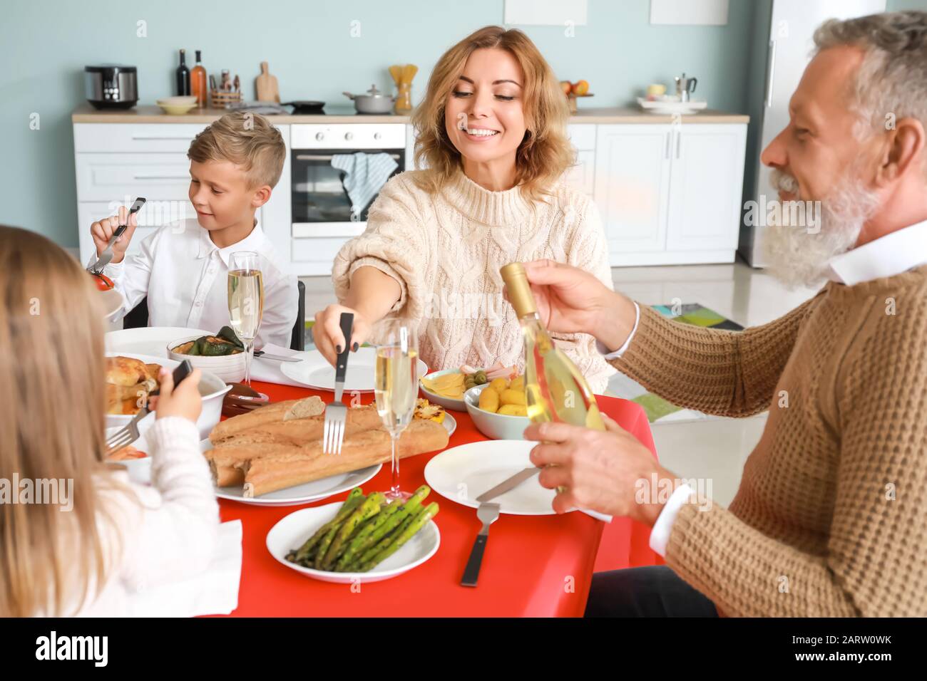 Big family having dinner at home Stock Photo - Alamy