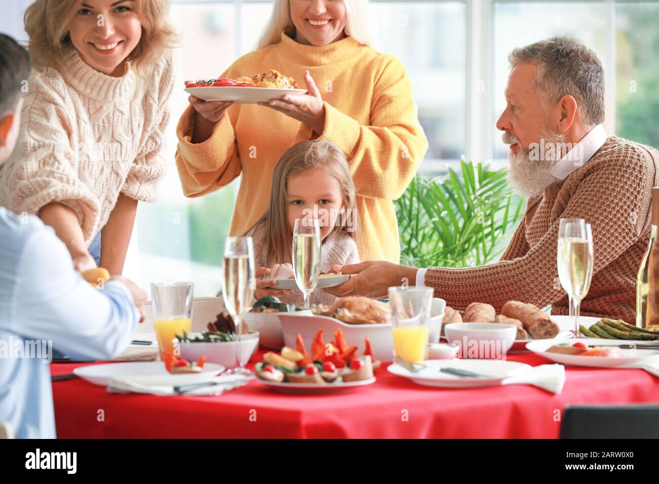 Big family having dinner at home Stock Photo - Alamy