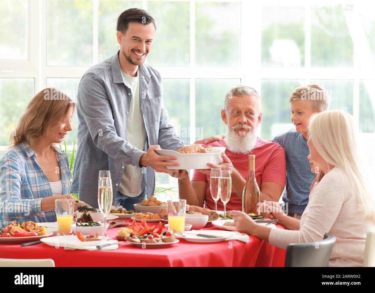 Big family having dinner at home Stock Photo - Alamy