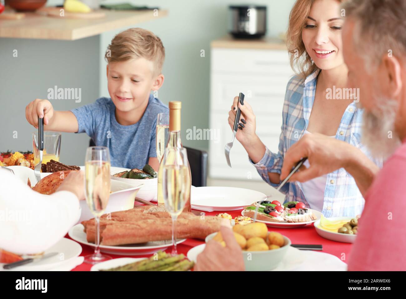 Big family having dinner at home Stock Photo - Alamy
