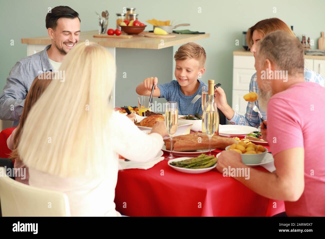 Big family having dinner at home Stock Photo - Alamy