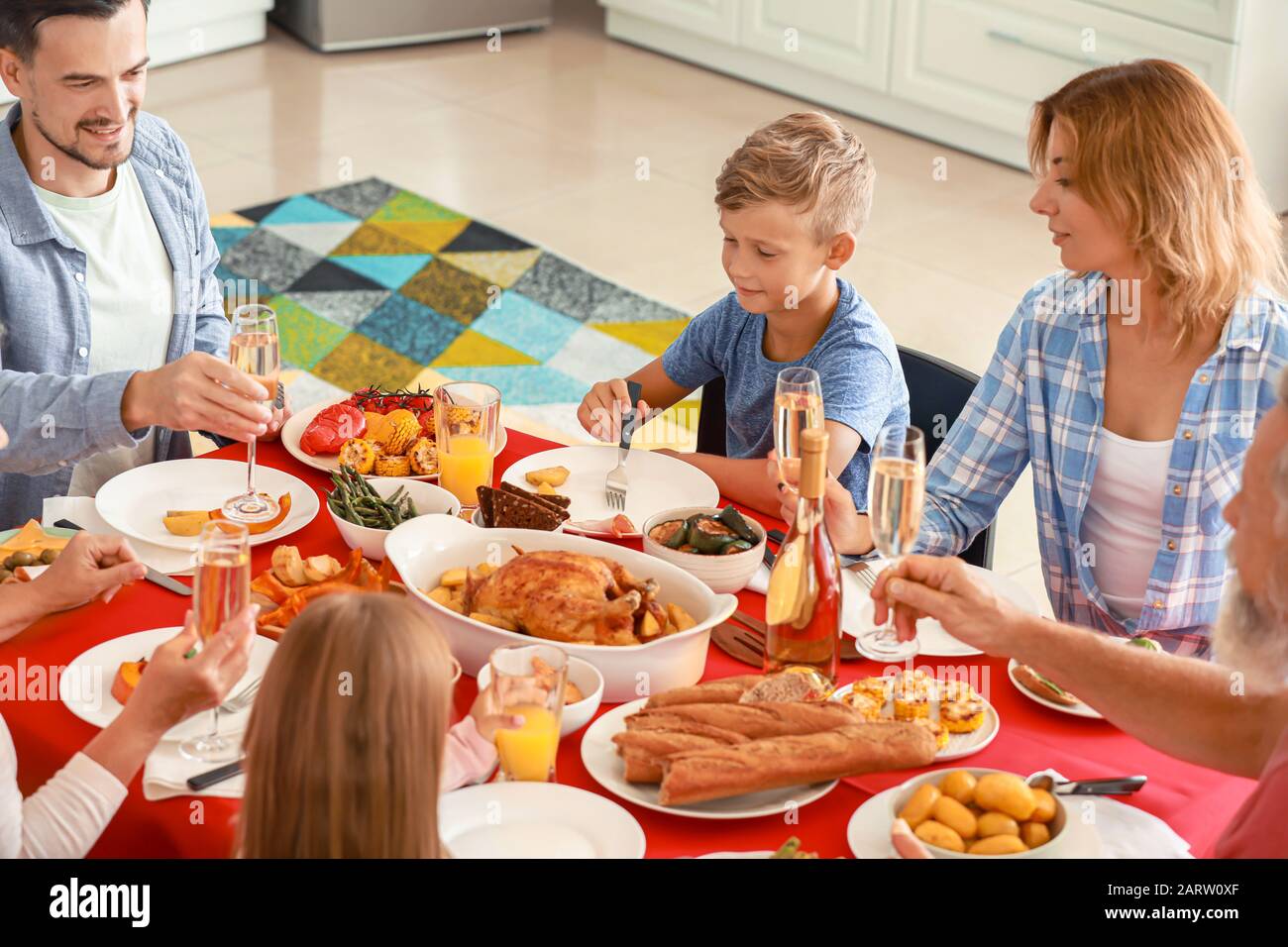 Big family having dinner at home Stock Photo - Alamy