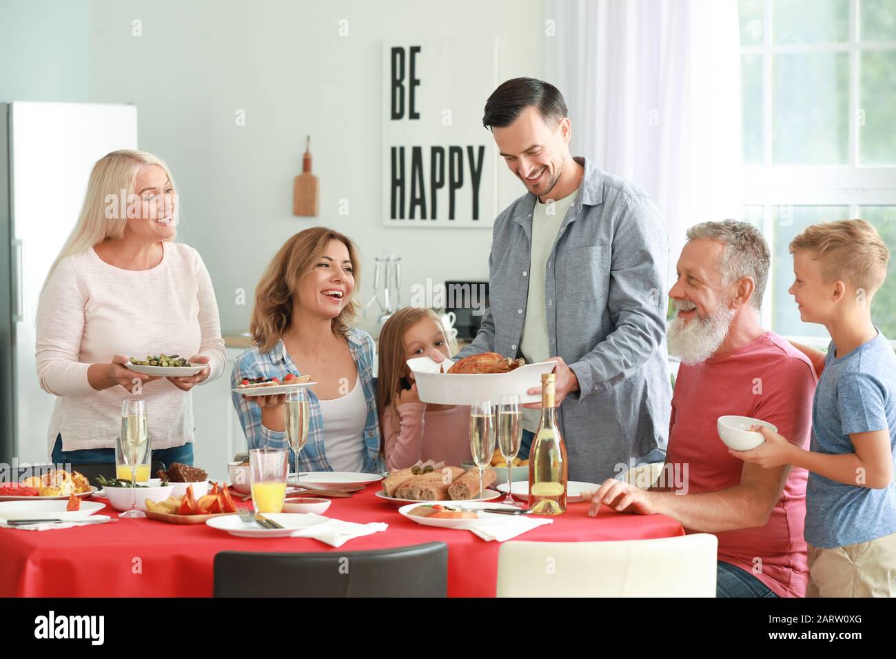 Big family having dinner at home Stock Photo - Alamy