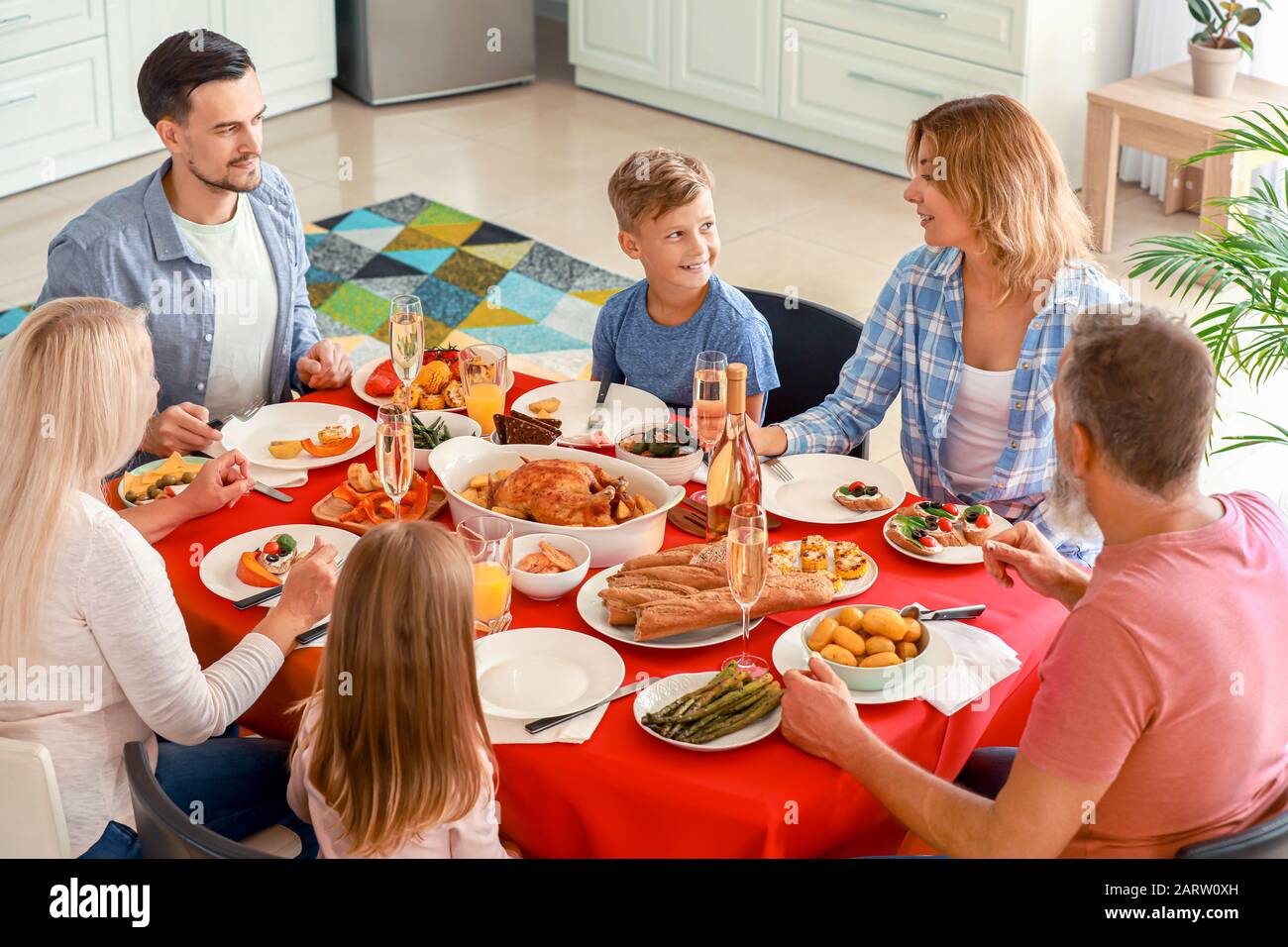 Big family having dinner at home Stock Photo - Alamy