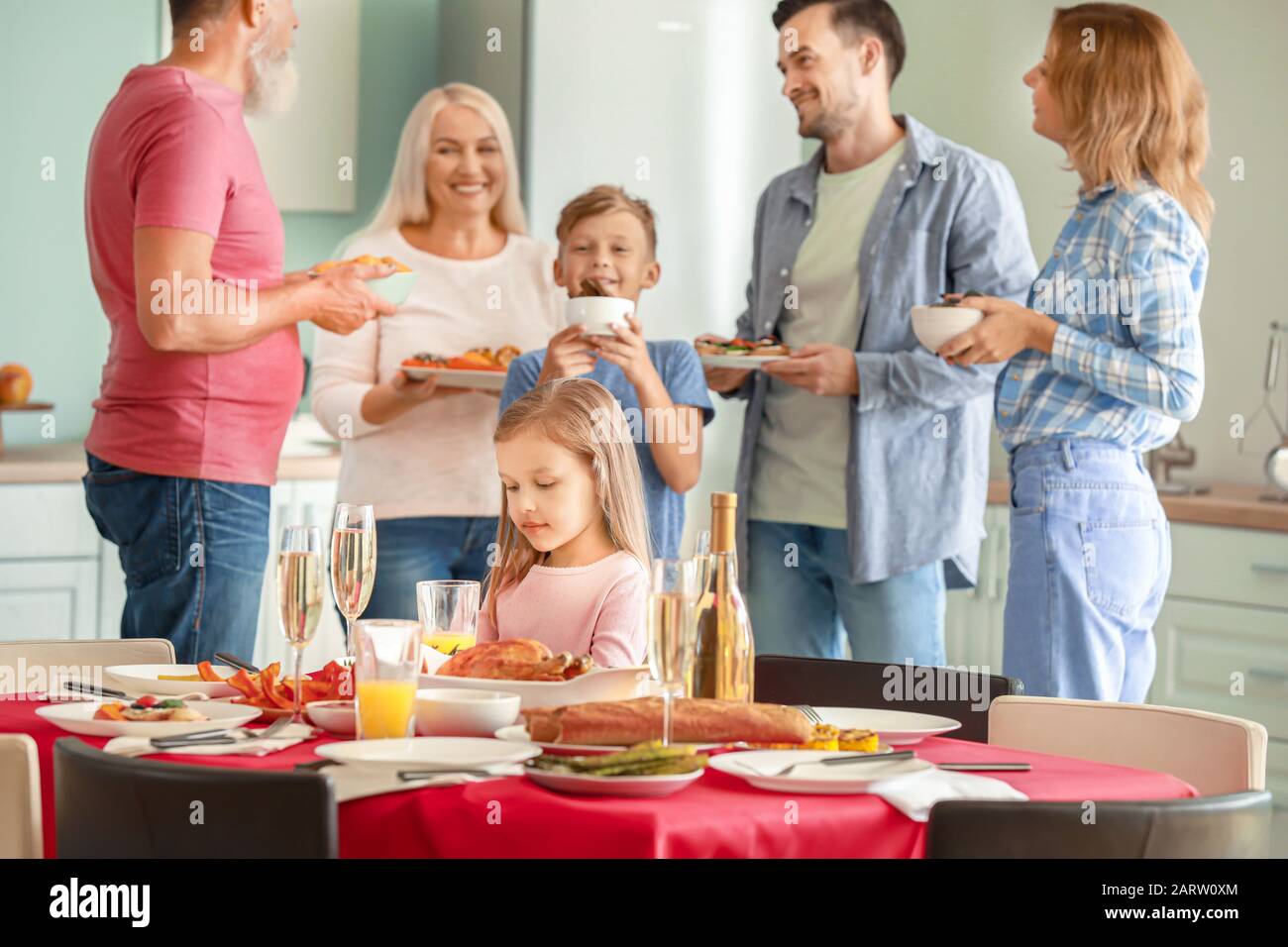 Big family serving table for dinner at home Stock Photo - Alamy