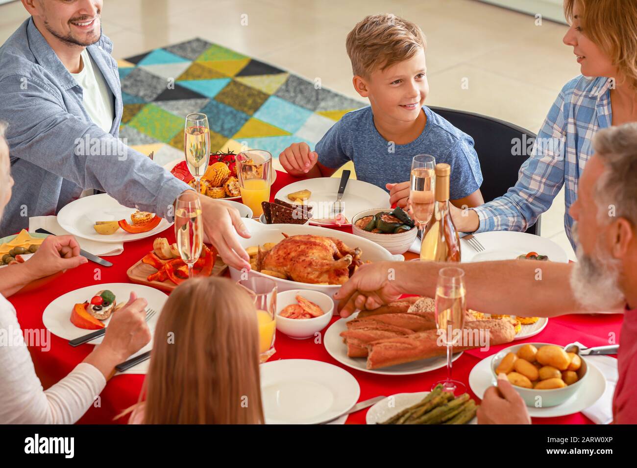 Big family having dinner at home Stock Photo - Alamy