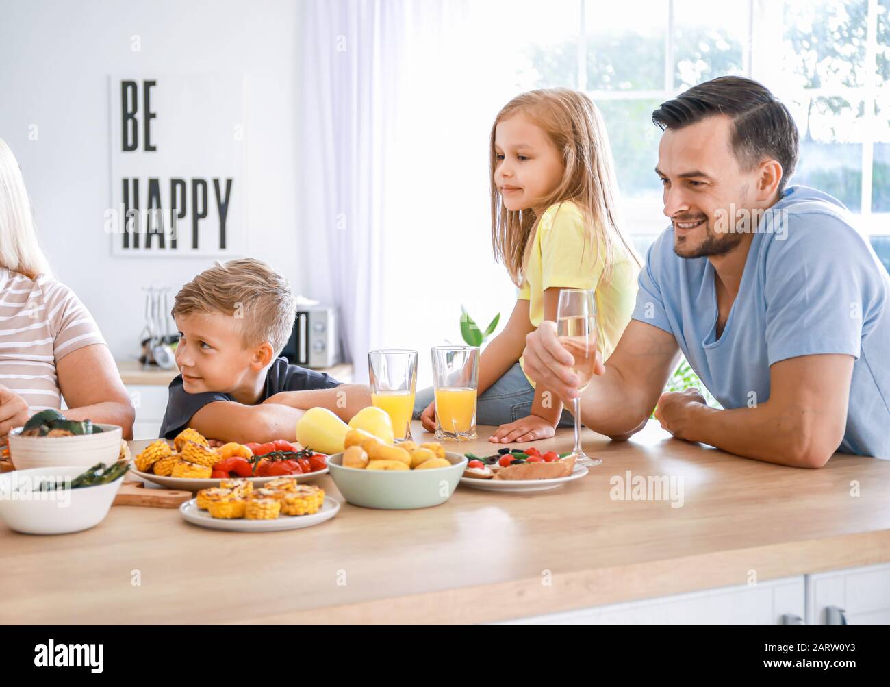 Big family having dinner at home Stock Photo - Alamy