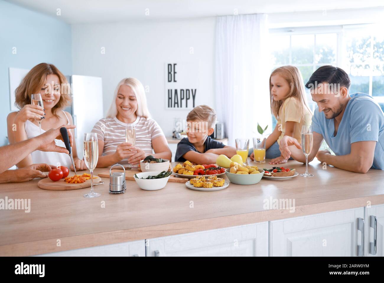 Big family having dinner at home Stock Photo - Alamy