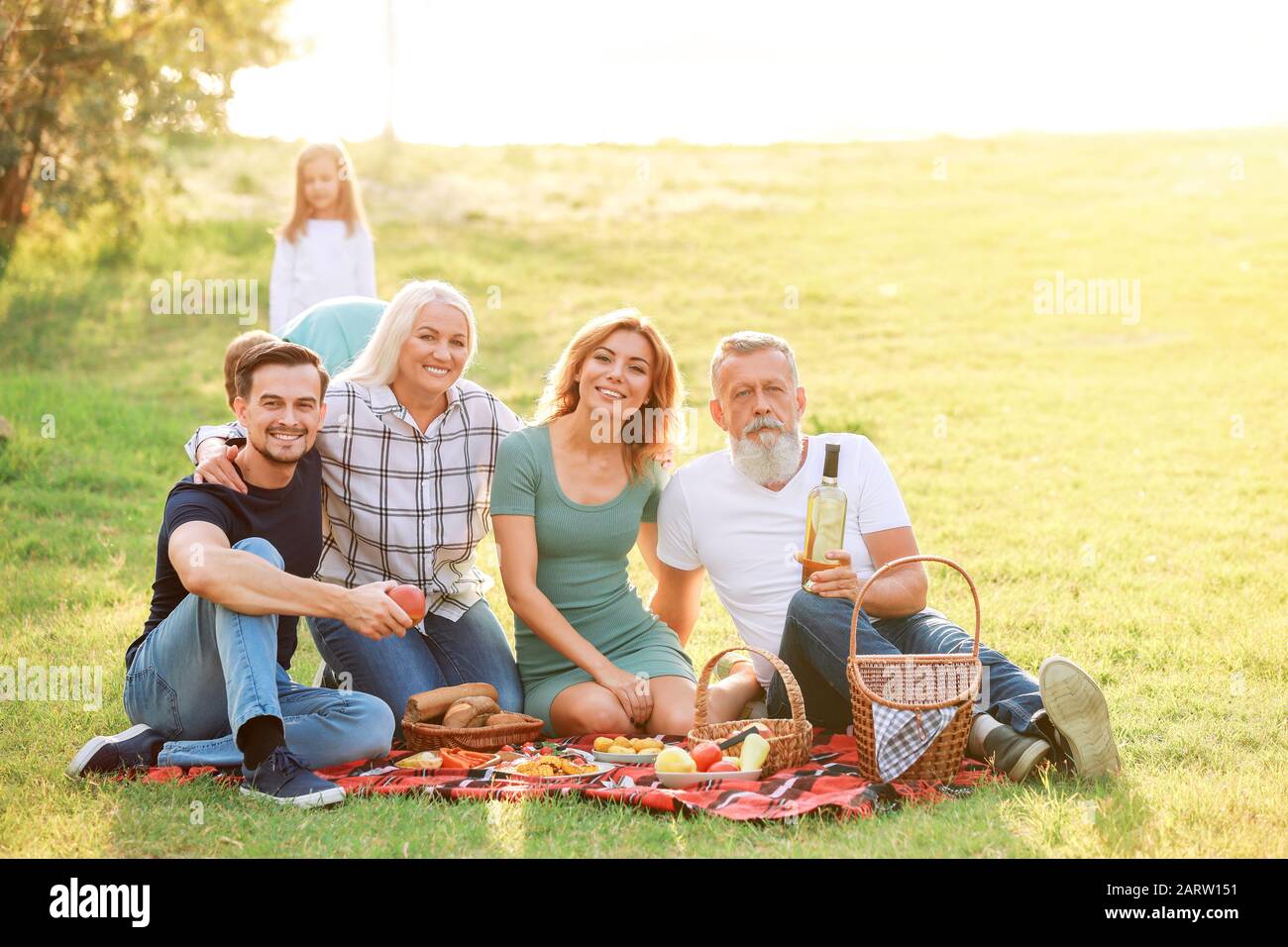 Big family having picnic in park Stock Photo - Alamy