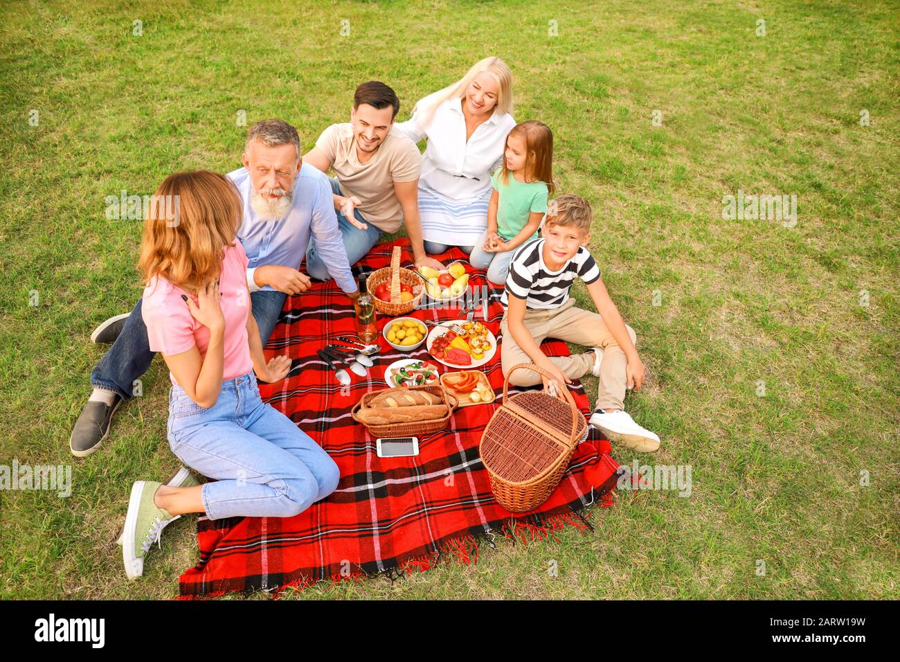 Big family having picnic in park Stock Photo - Alamy