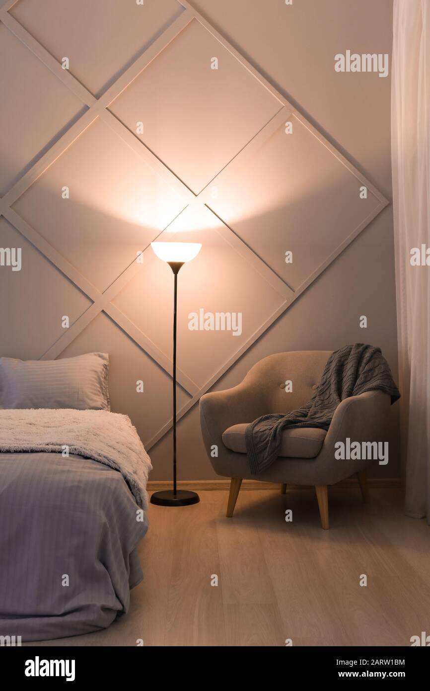Stylish interior of bedroom at night Stock Photo - Alamy