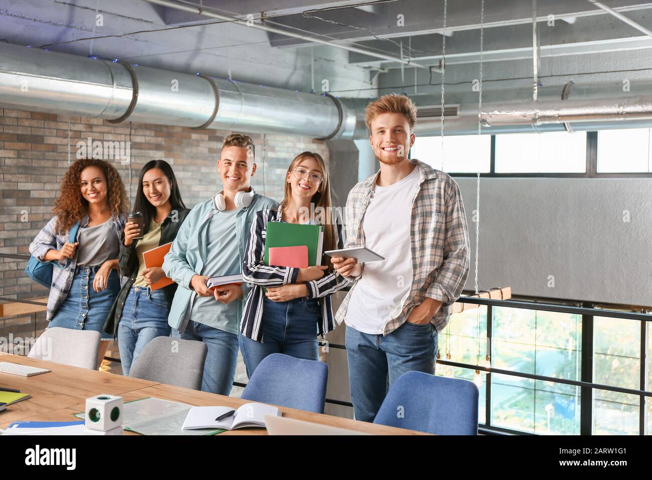 Group of students in university Stock Photo - Alamy