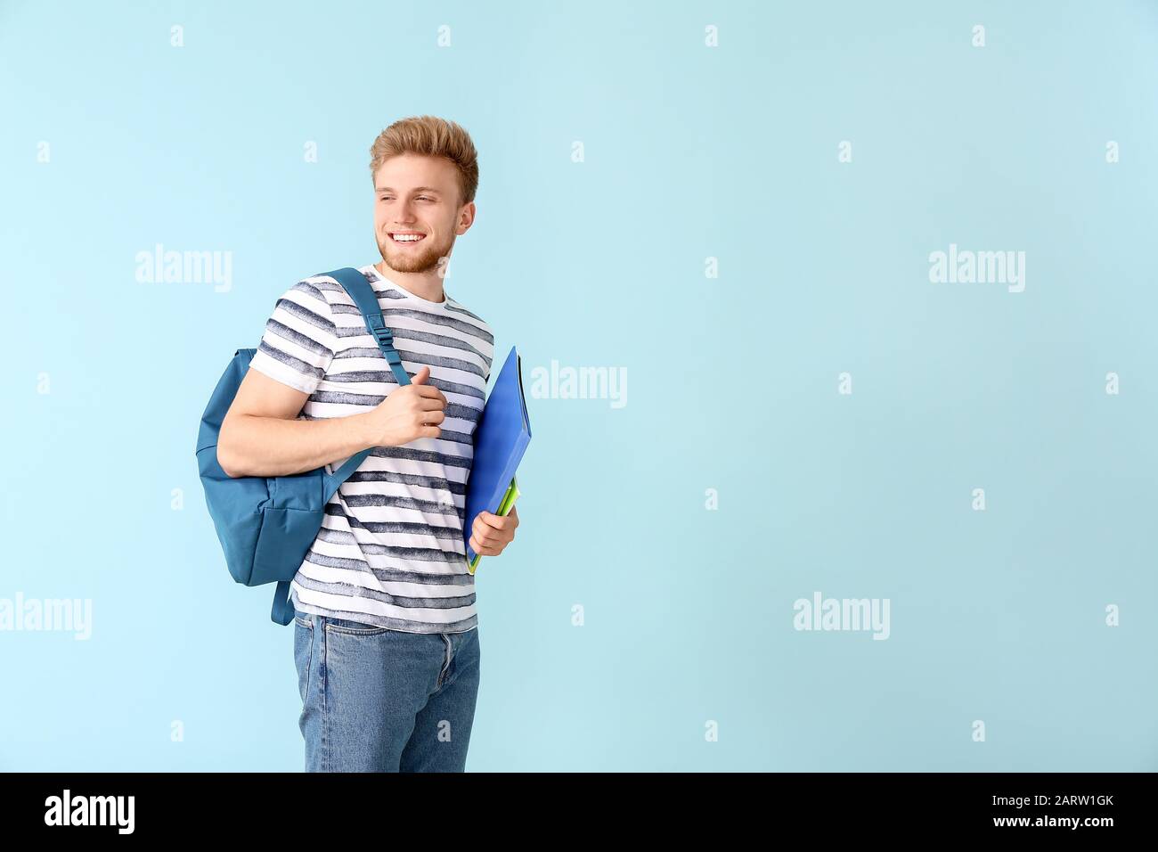 Portrait of male student on color background Stock Photo - Alamy