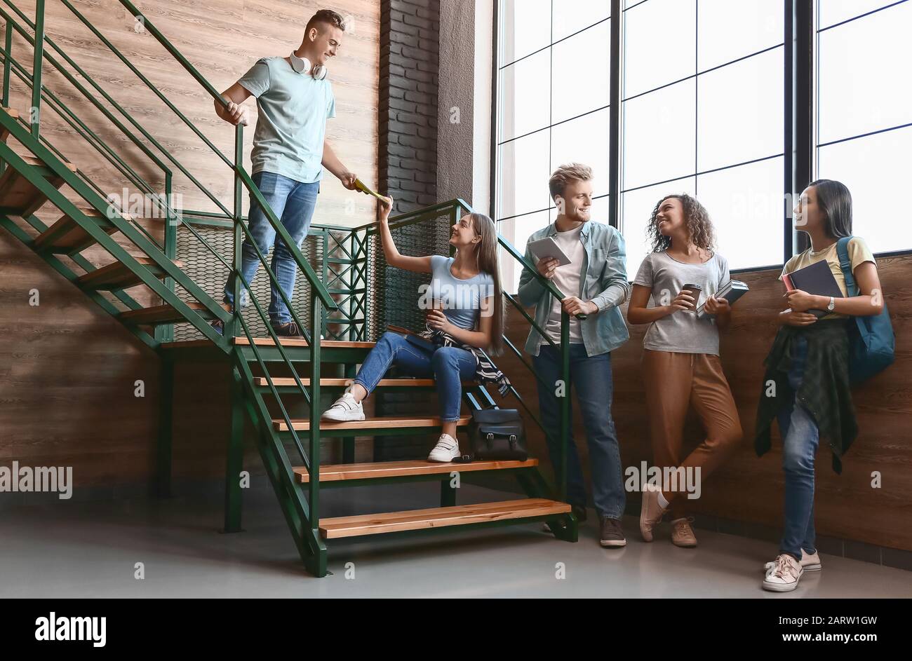 Group of students in university Stock Photo - Alamy