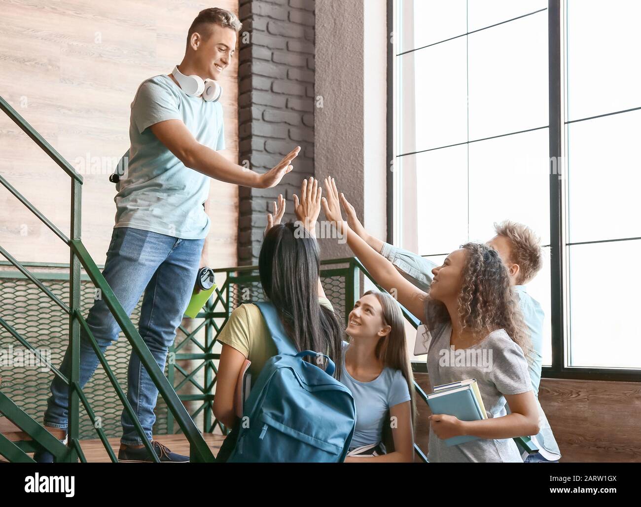 Group of students in university Stock Photo - Alamy
