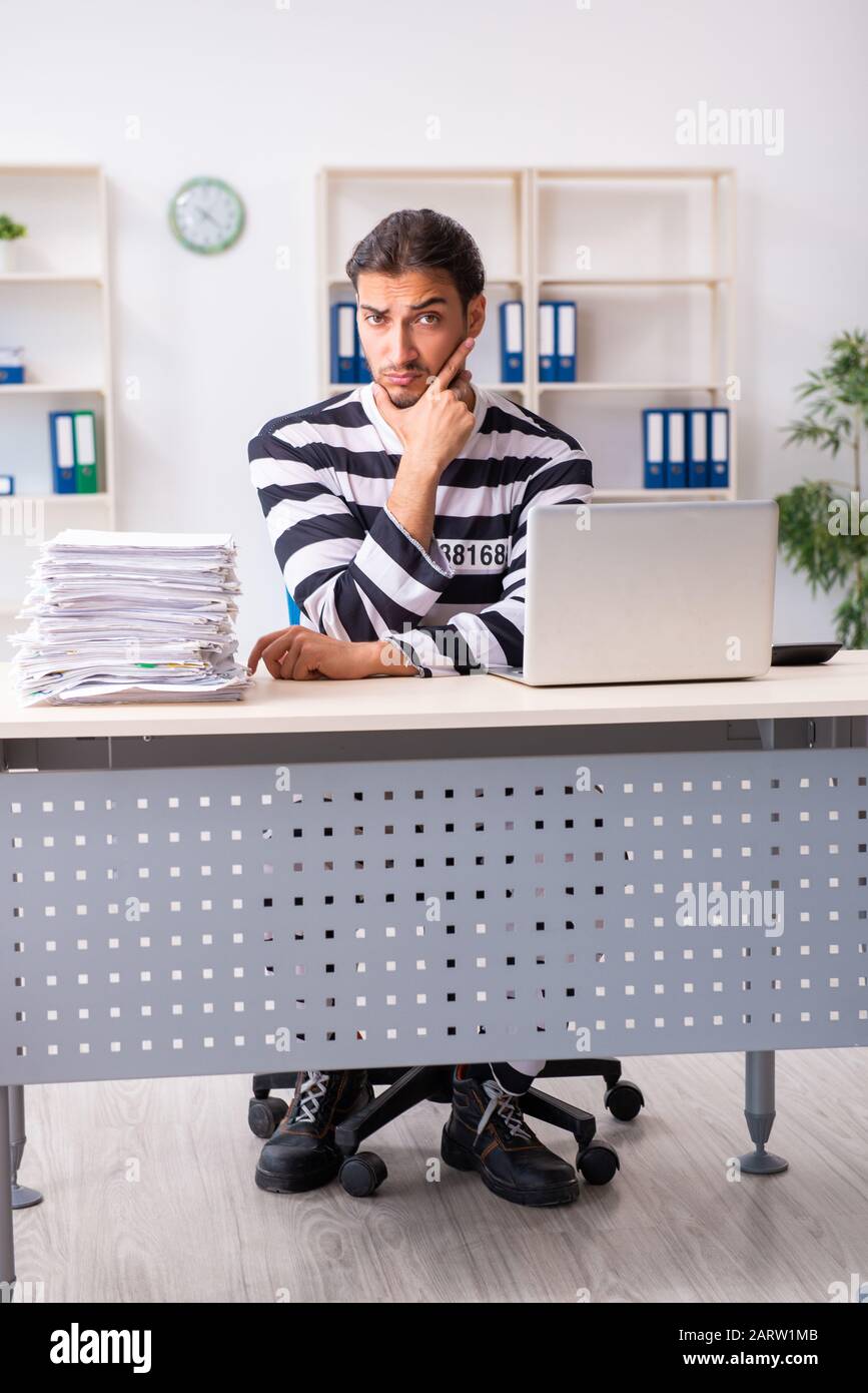 The young employee feeling like prisoner at work Stock Photo - Alamy