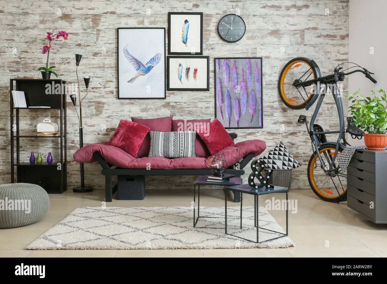 Stylish interior of modern living room with couch Stock Photo - Alamy