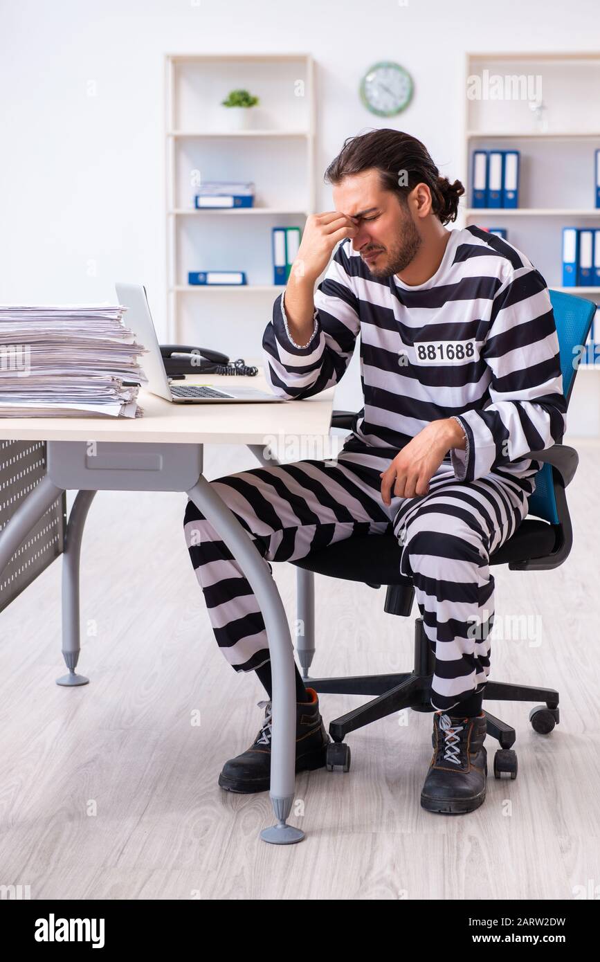 The young employee feeling like prisoner at work Stock Photo - Alamy