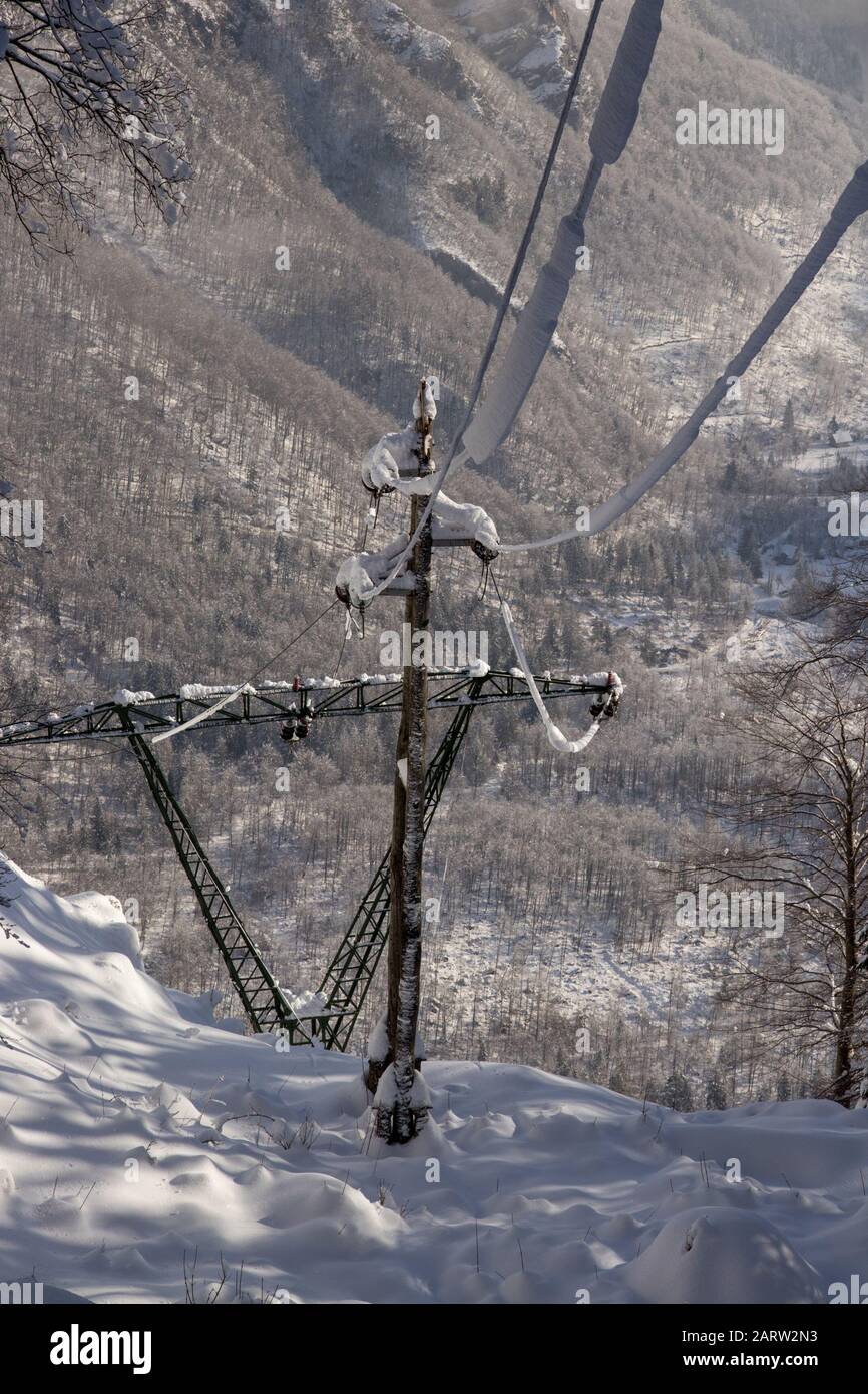Electrical cables going down towards valley Stock Photo - Alamy