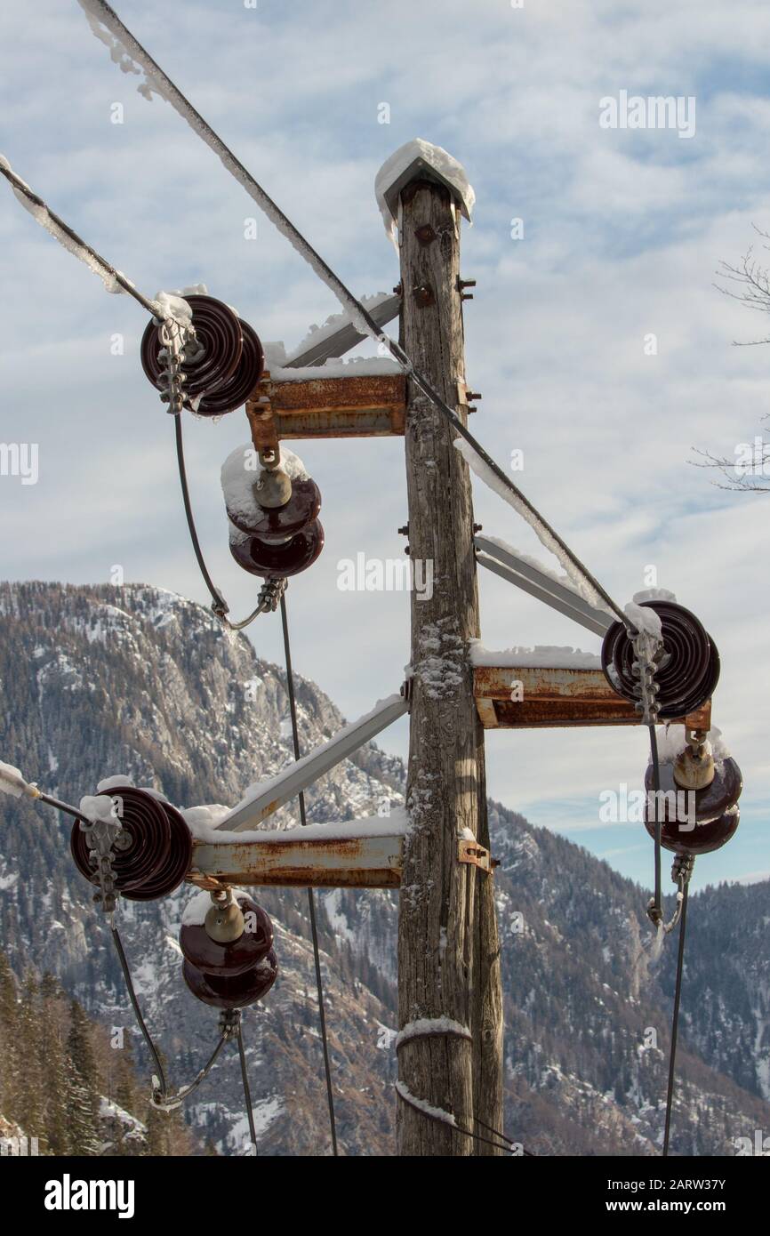 Electrical cables covered in snow, detailed look Stock Photo - Alamy