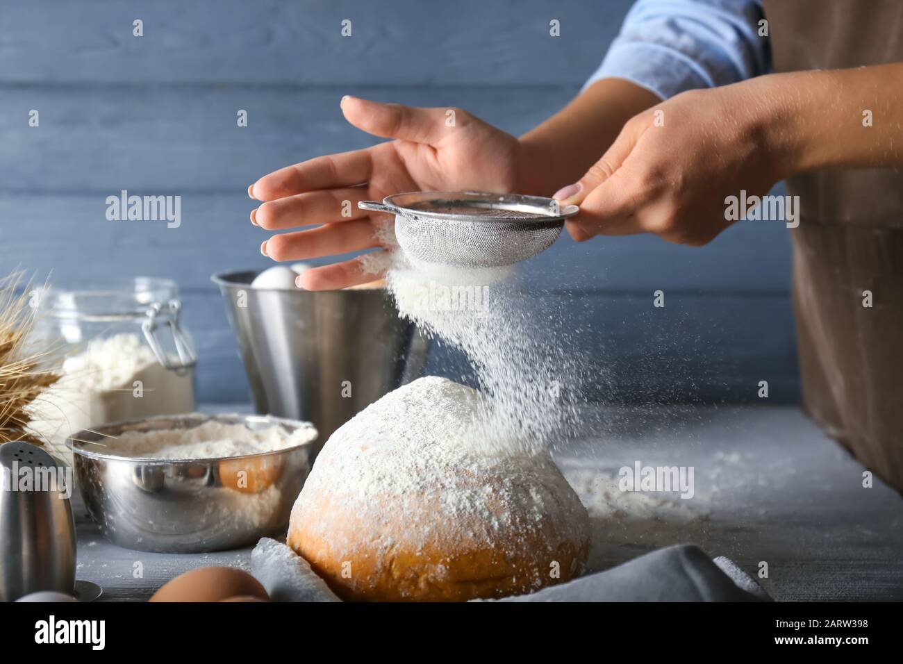 Woman sieving flour in hi-res stock photography and images - Alamy