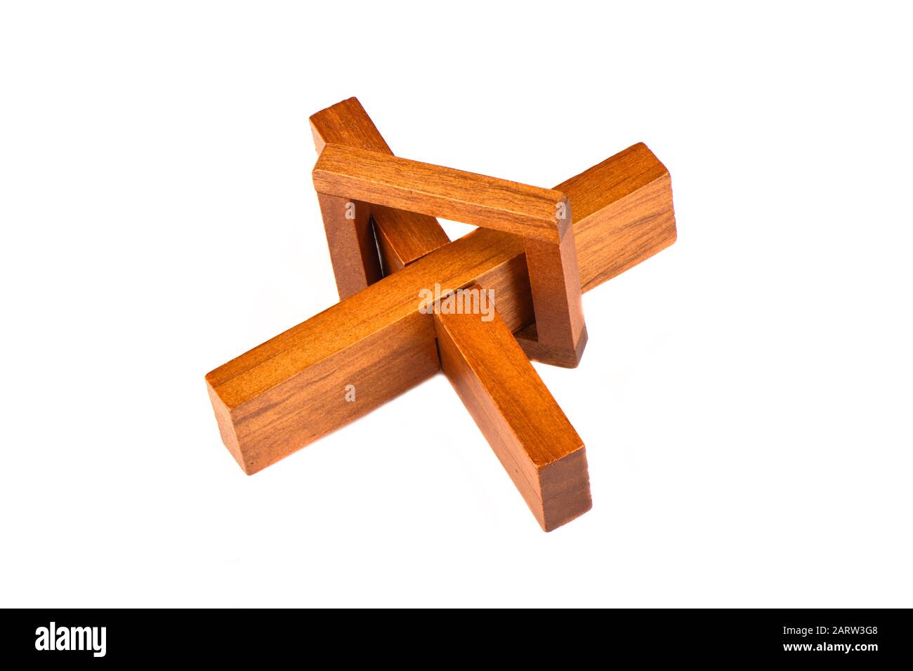 Wooden cross puzzle isolated on a white background. The goal of the ...