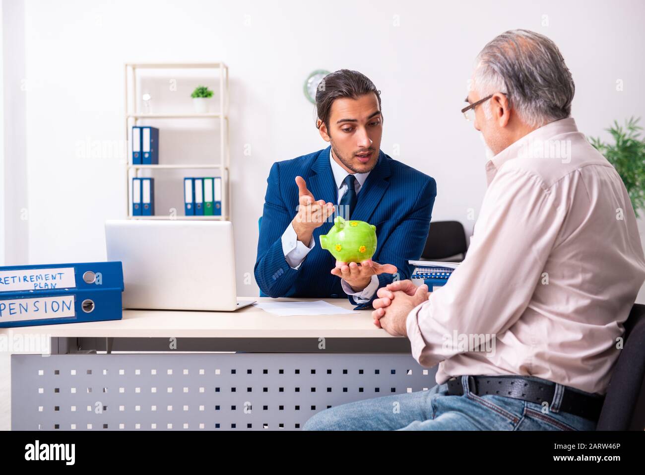 The financial advisor giving retirement advice to old man Stock Photo ...