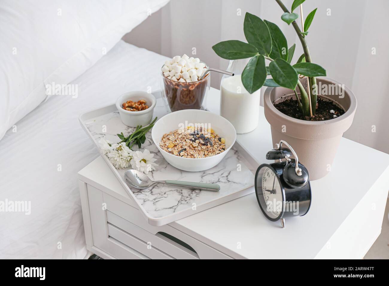 Tray with tasty breakfast on bedside table Stock Photo - Alamy