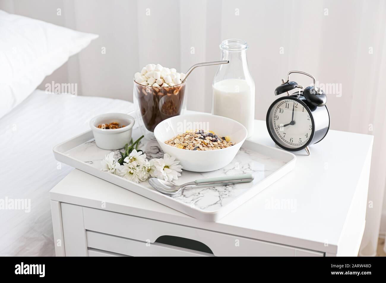 Tray with tasty breakfast on bedside table Stock Photo - Alamy