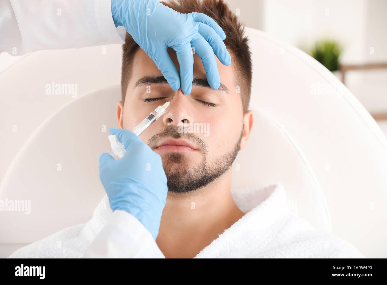 Handsome woman receiving injection in hi-res stock photography and ...
