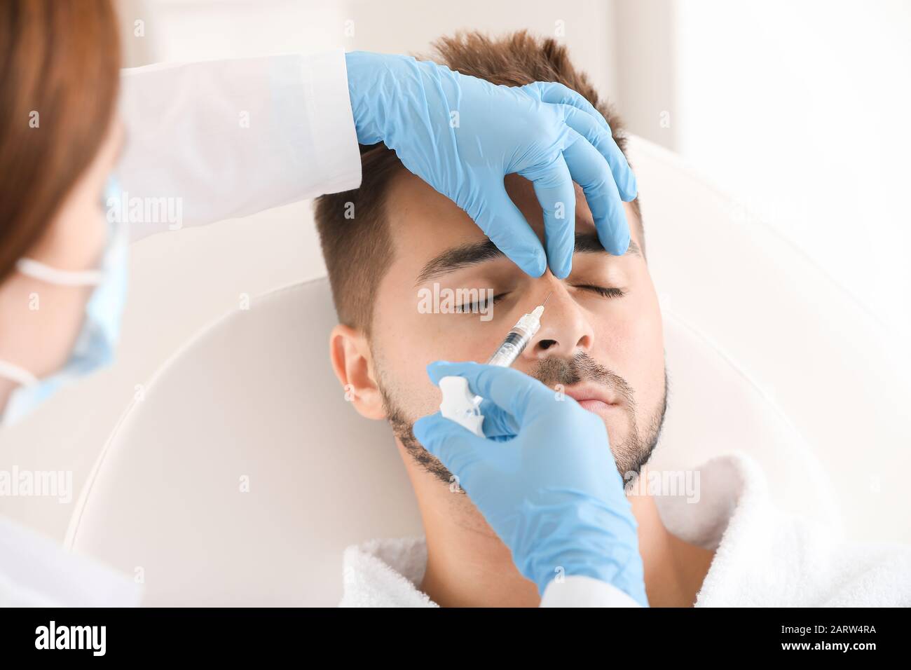 Handsome woman receiving injection in hi-res stock photography and ...