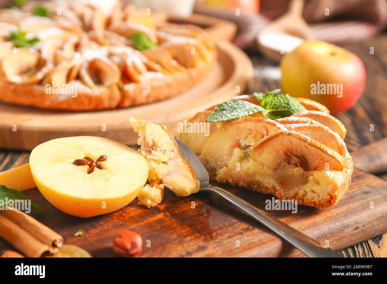 Piece of apple pie on wooden board, closeup Stock Photo - Alamy