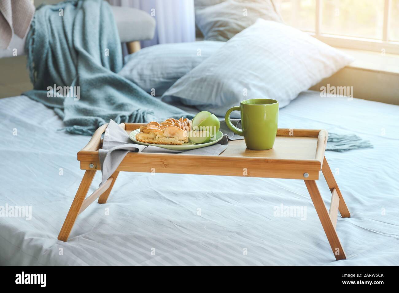 Table with tasty breakfast on bed Stock Photo - Alamy