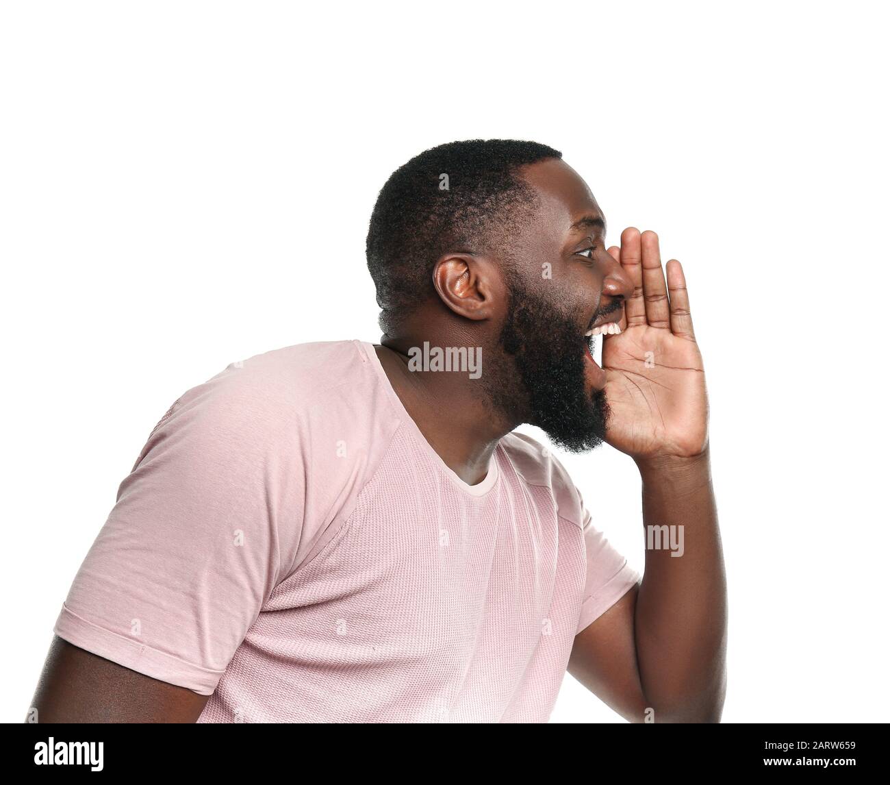 Calling African-American man on white background Stock Photo - Alamy