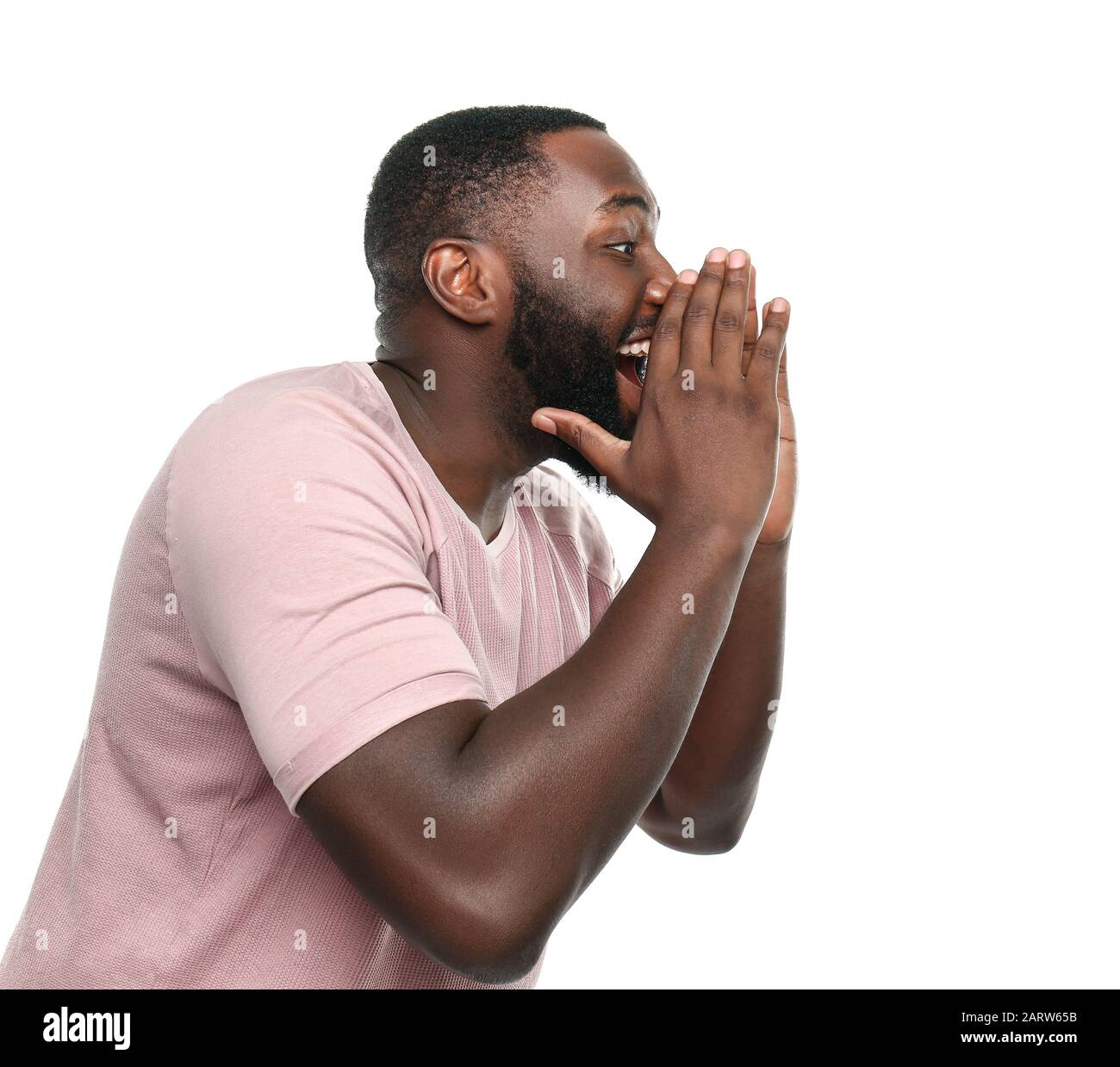 Calling African-American man on white background Stock Photo - Alamy
