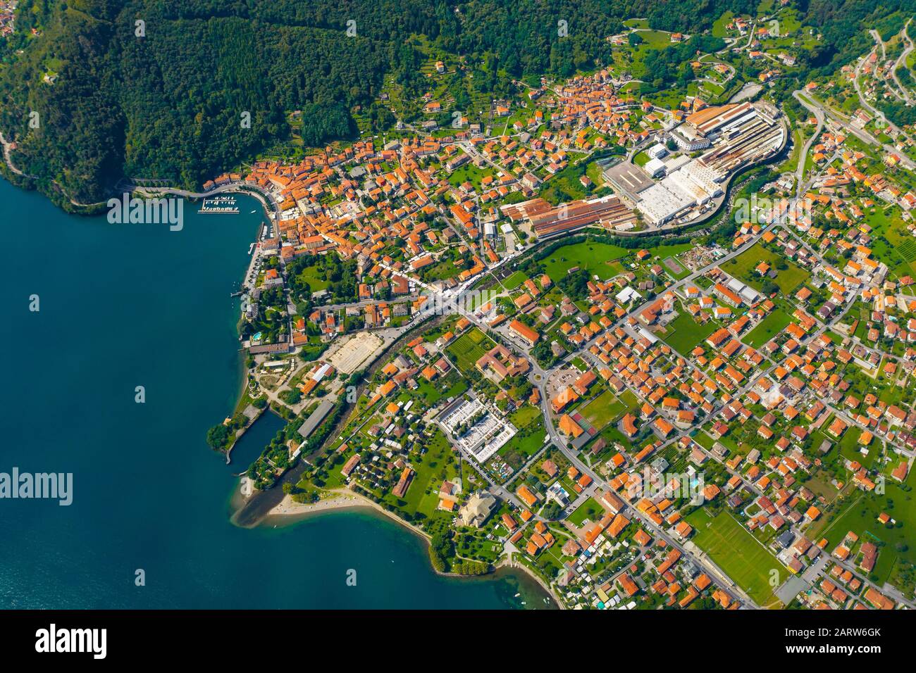 Aerial view of Como lake, Dongo, Italy. Coastline is washed by blue ...